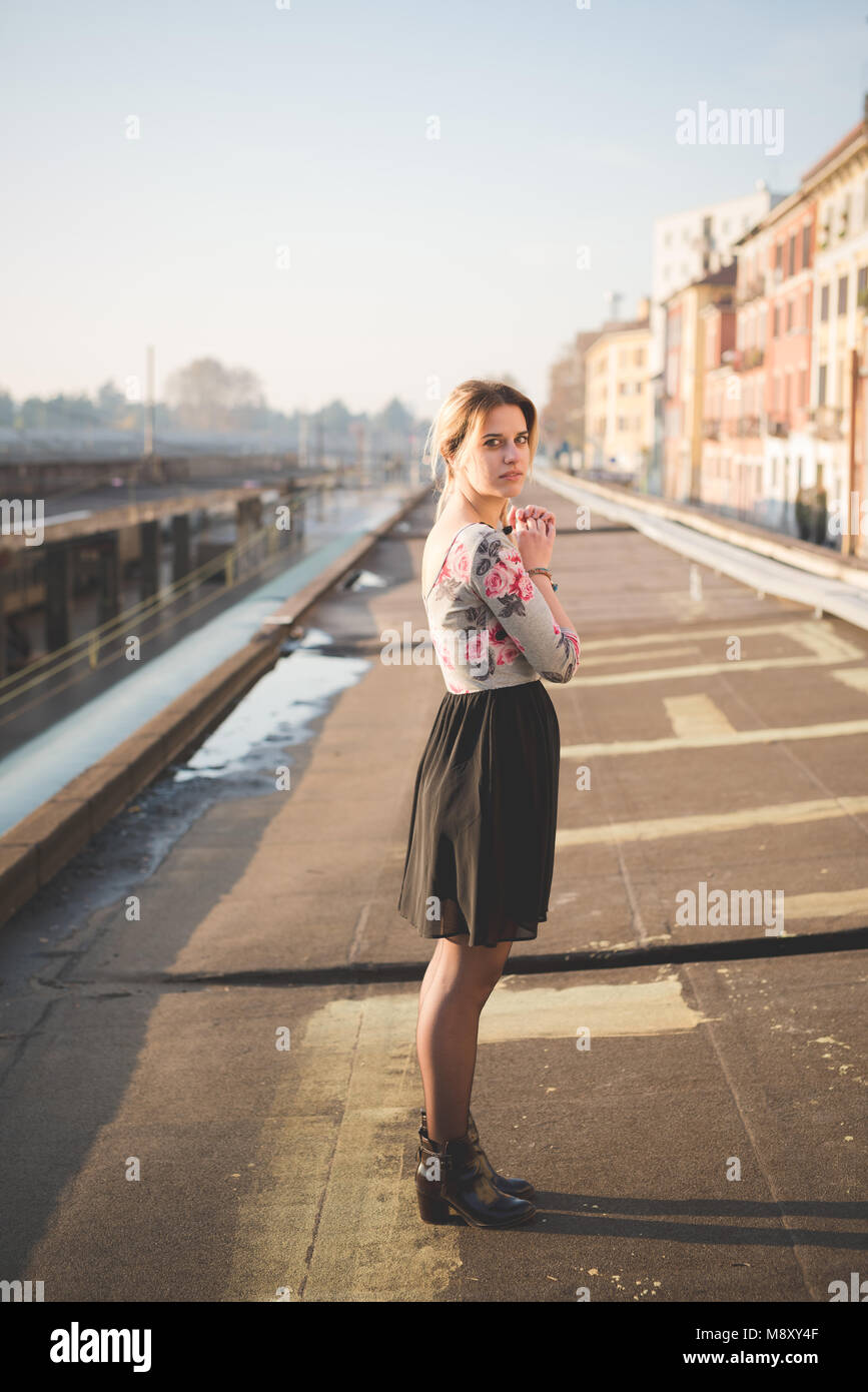 Young Woman Outdoor Back Light Posing Looking Camera Smiling Serene