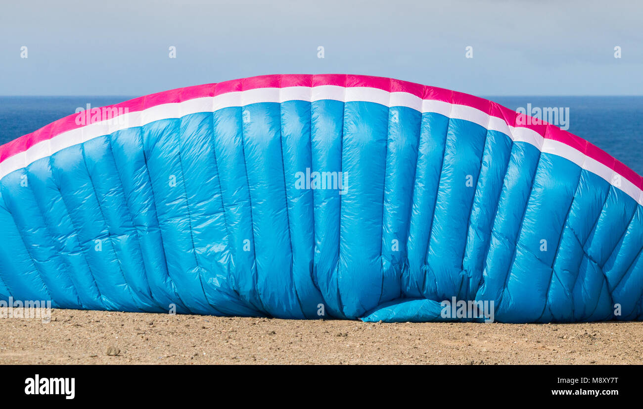 Colourful paragliding canopy/wing against blue sky Stock Photo - Alamy