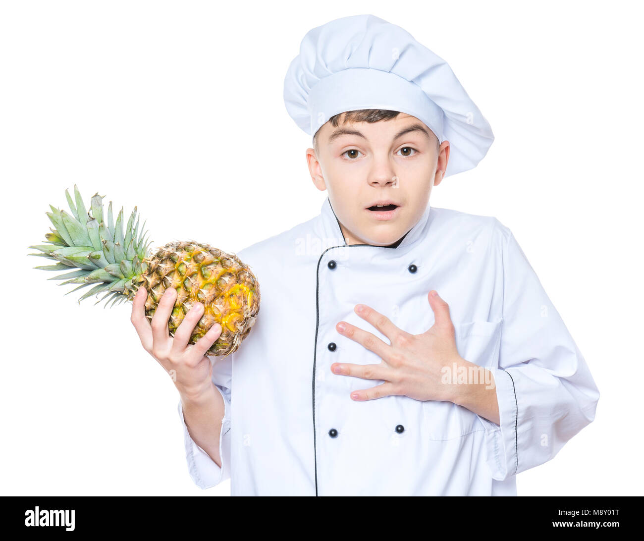 Teen boy wearing chef uniform Stock Photo - Alamy