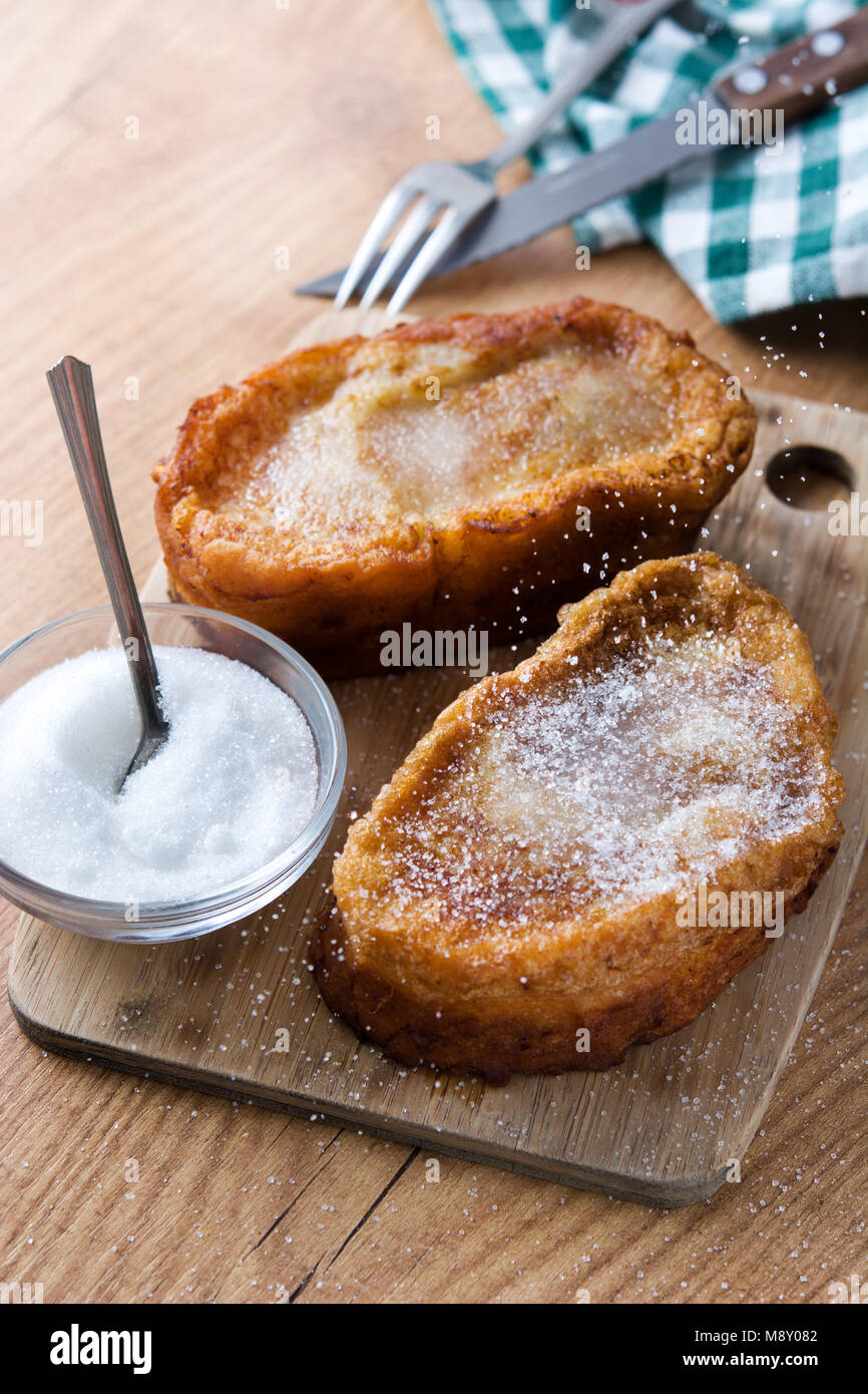 Traditional homemade Spanish torrijas on wooden background. Easter ...
