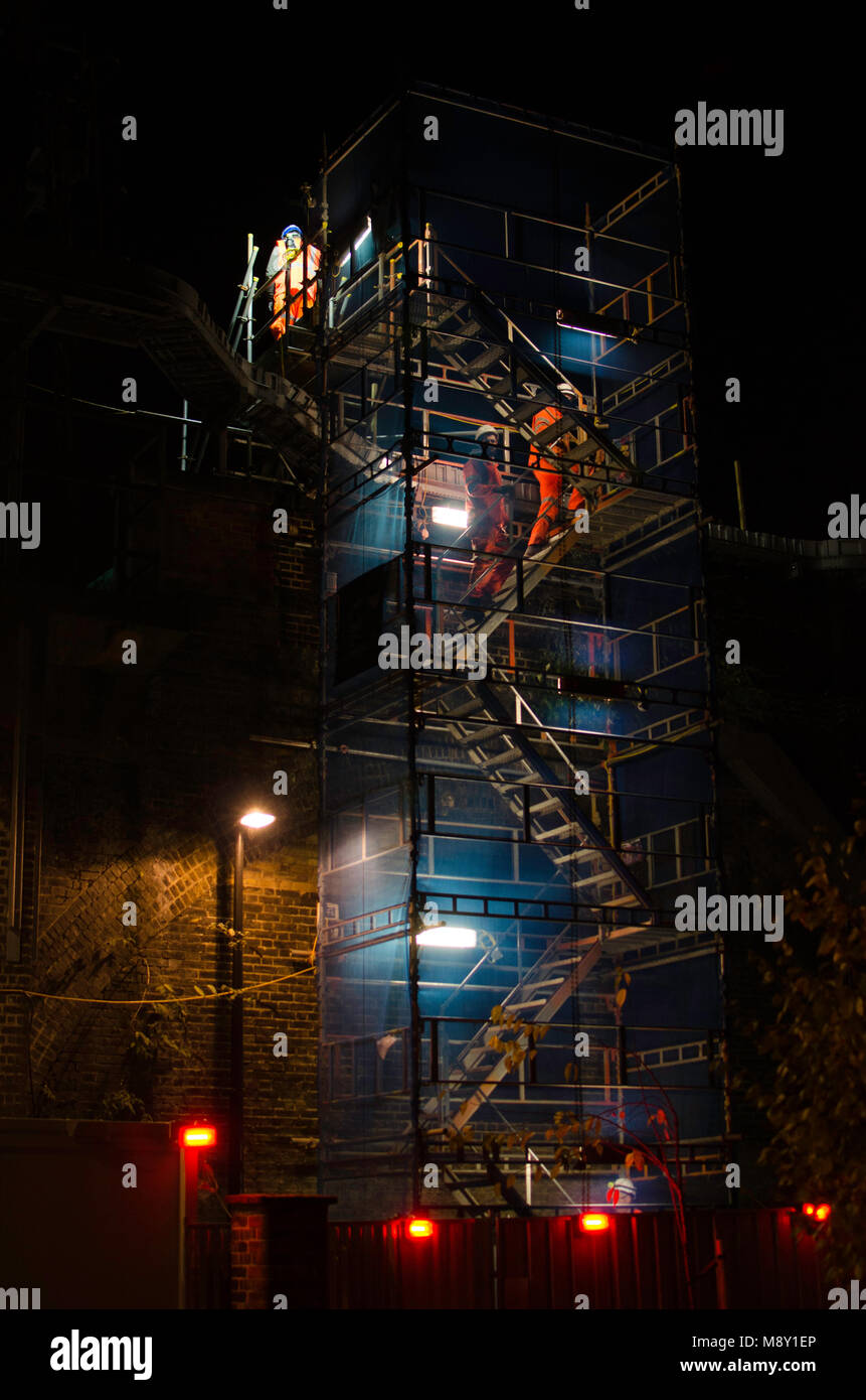 Construction workers at night Stock Photo - Alamy
