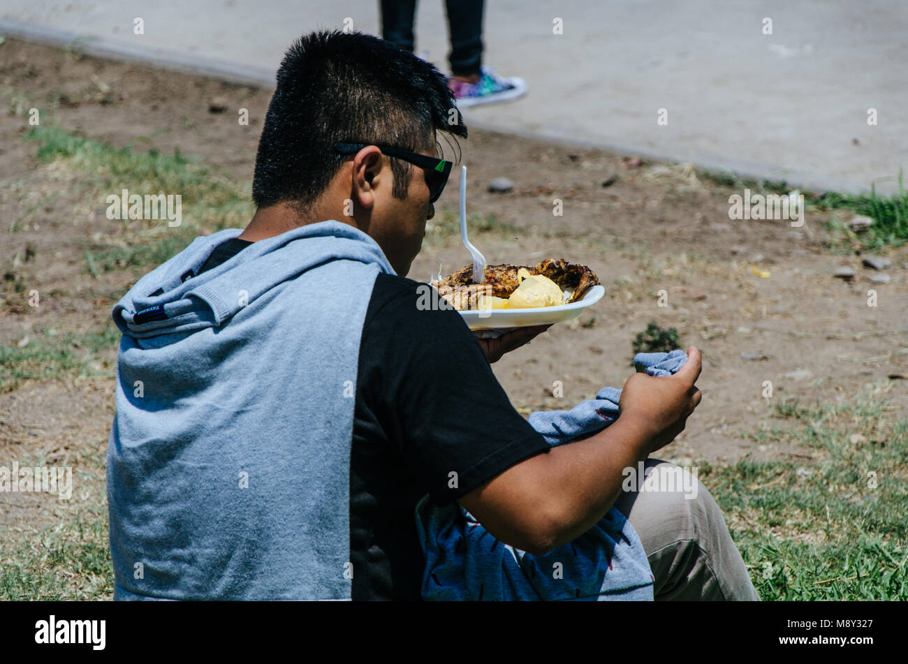 Young man eating healthy meal hi-res stock photography and images - Alamy