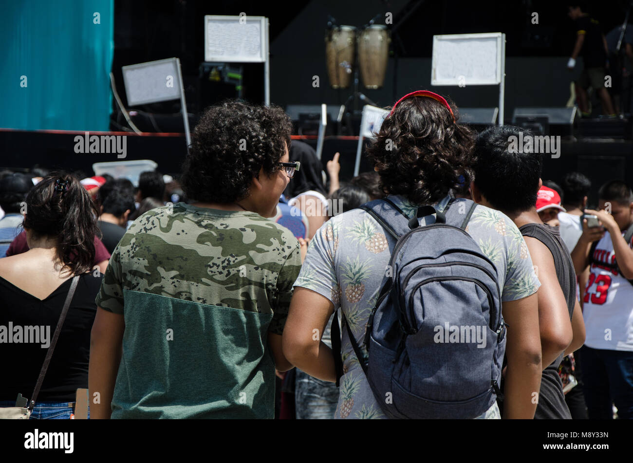 Two friends enjoying the rock concert in Lima - Peru Stock Photo - Alamy