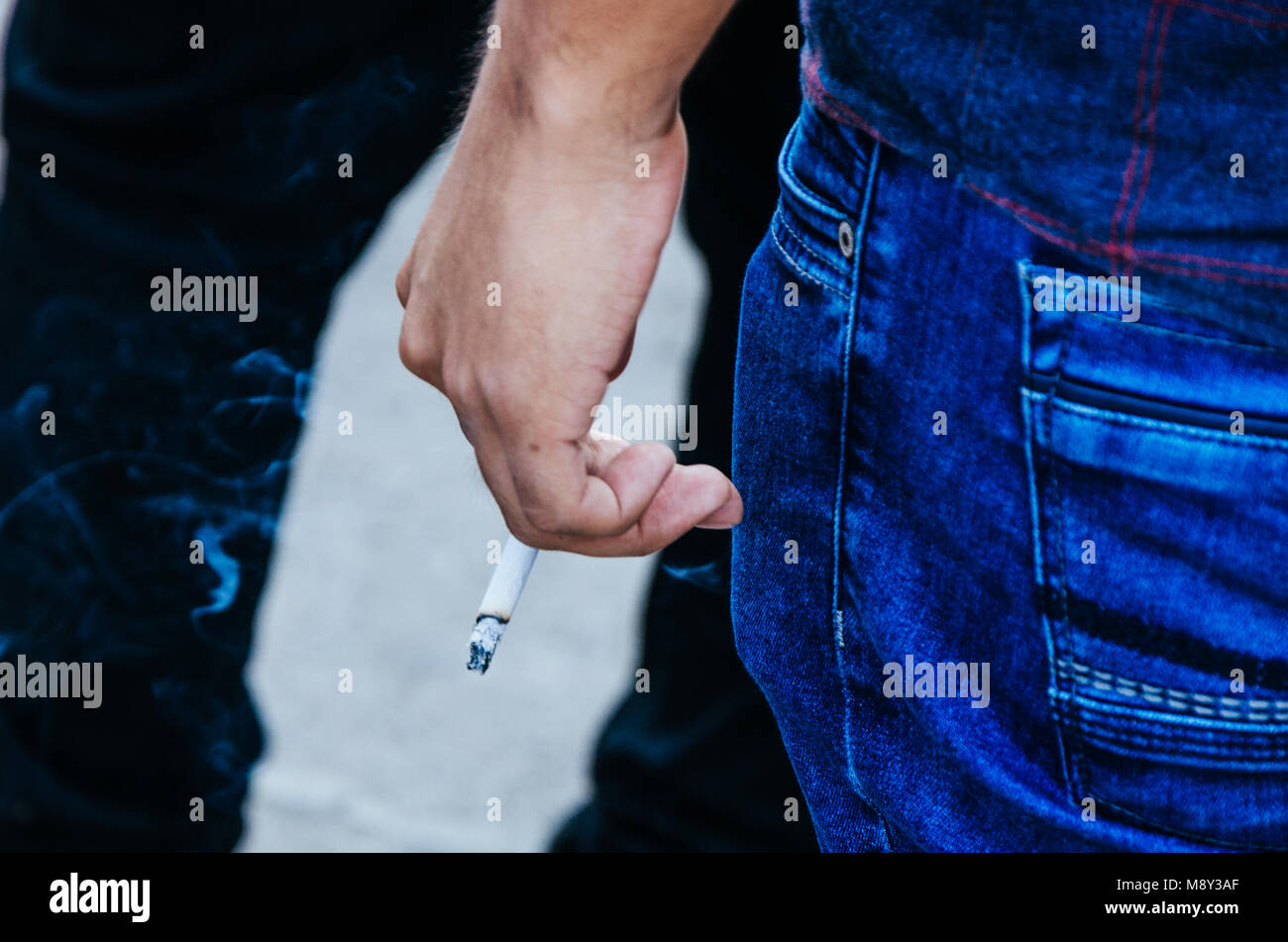 Smoking cigarette in male hand hi-res stock photography and images - Alamy