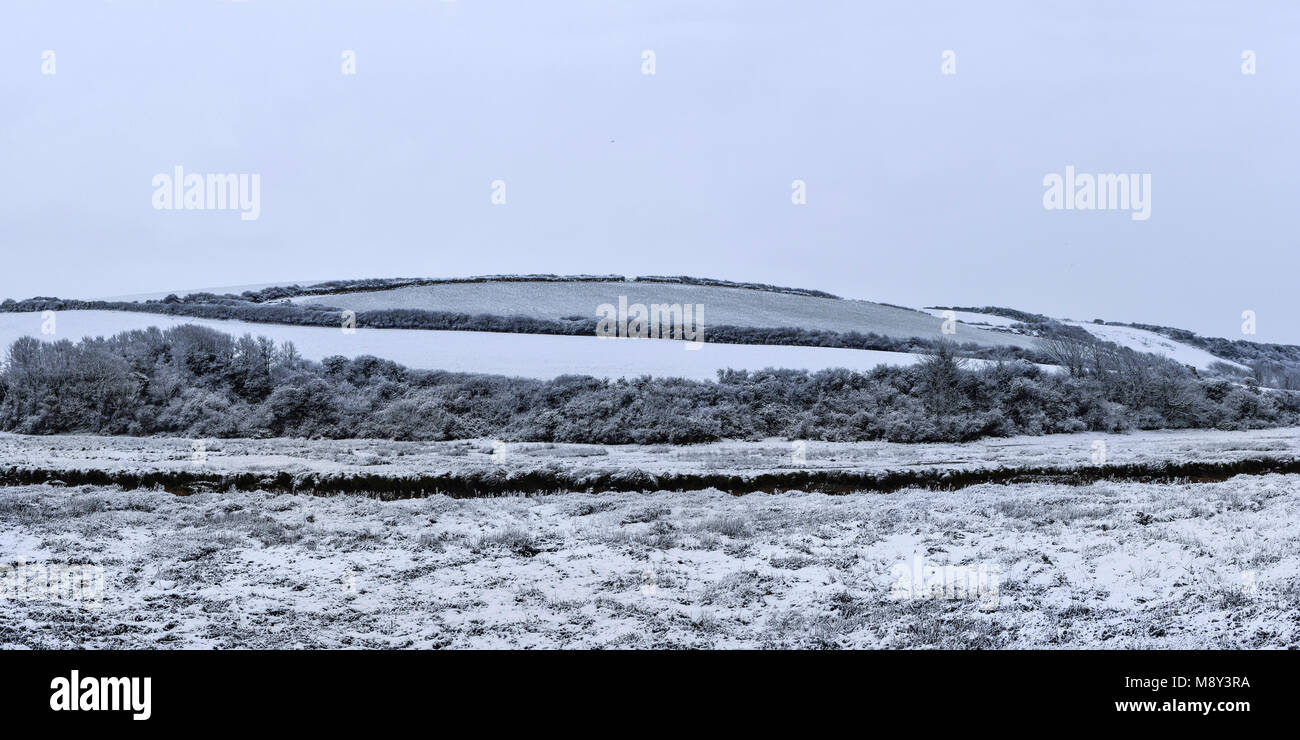 A panoramic view of snow covered hill overlooking the Gannel River in ...