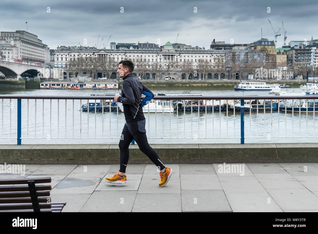 A man running along the South Bank in London Stock Photo - Alamy