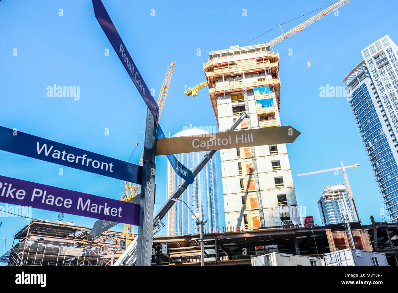 Seattle downtown road signs with new buildings under construction and ...