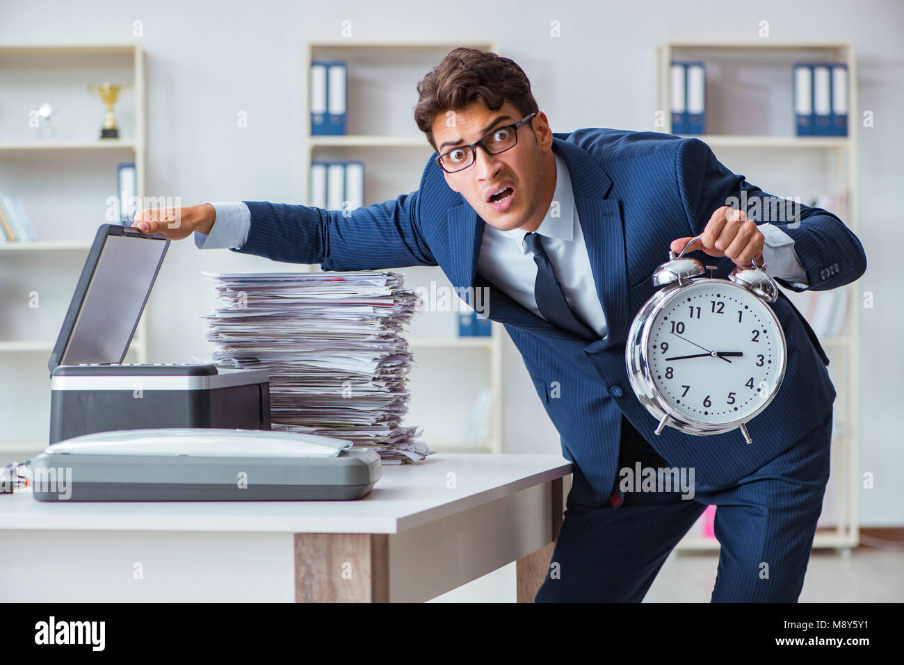 Businessman making copies in copying machine Stock Photo - Alamy