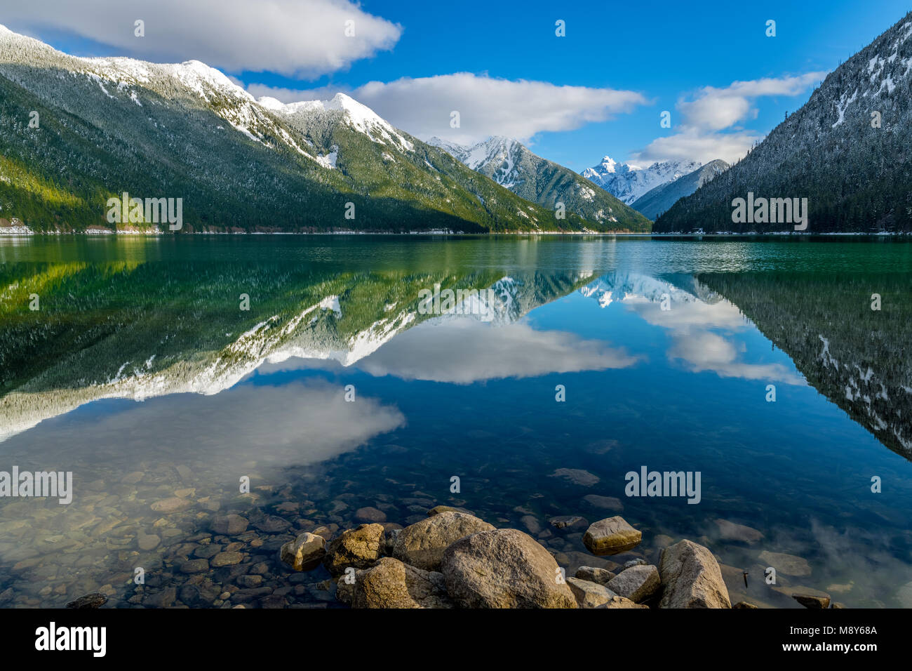 Chilliwack Lake with the reflecting Mount Redoubt, which is a part of ...