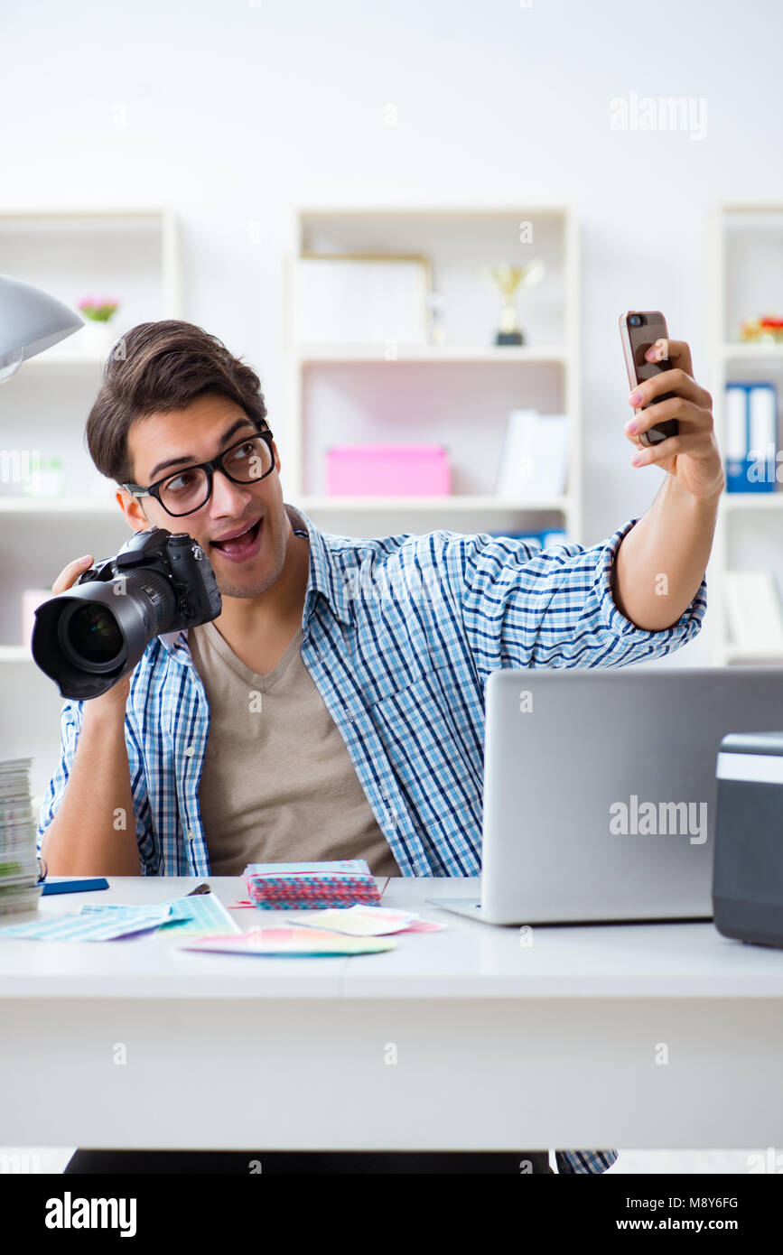 Young photographer working with his camera Stock Photo - Alamy