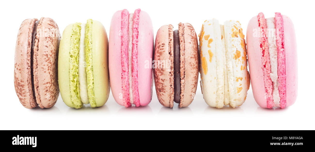 Different types of french sweet cookies, macaroons in row. Isolated on ...