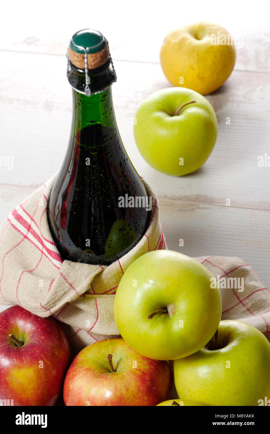 bottle of french cider with yellow and red apples Stock Photo - Alamy