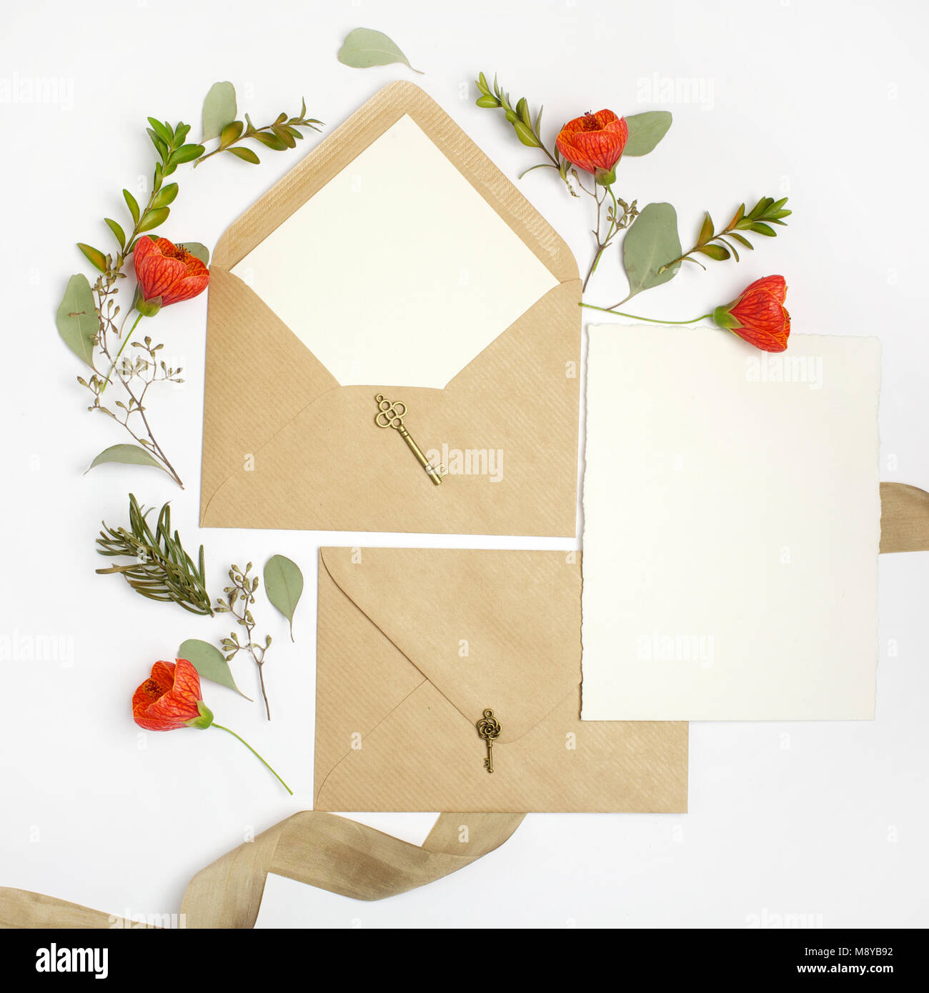 Flat lay shot of letter and eco paper envelope on white background ...