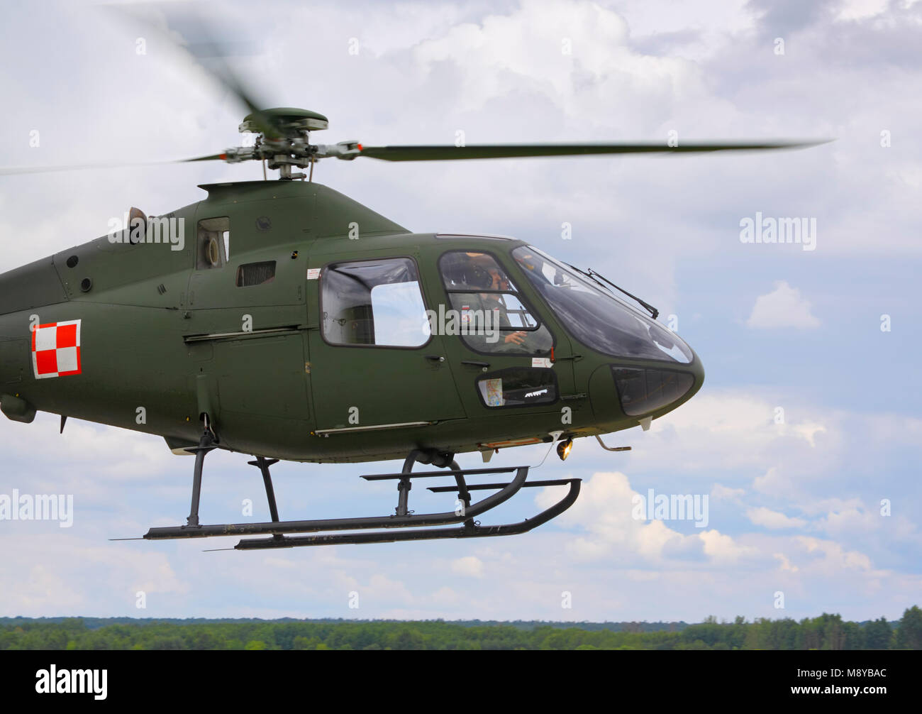 The Polish Air Force PZL SW-4 Puszczyk (Tawny Owl) flying over cloudy ...