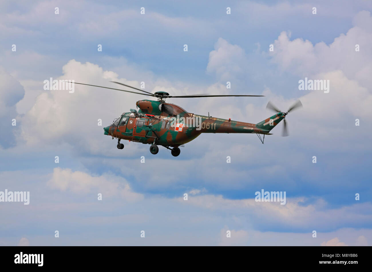 The Polish Air Force PZL W-3 Sokol (Falcon) flying over cloudy sky ...