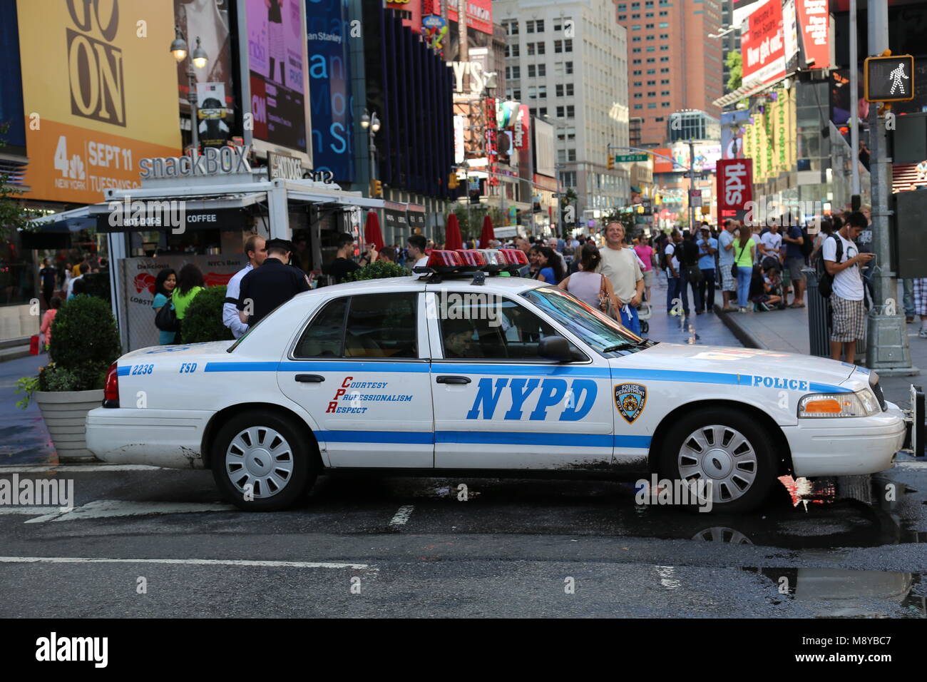 Police car with a patrol on duty at Times Square. NYC, USA Stock Photo ...