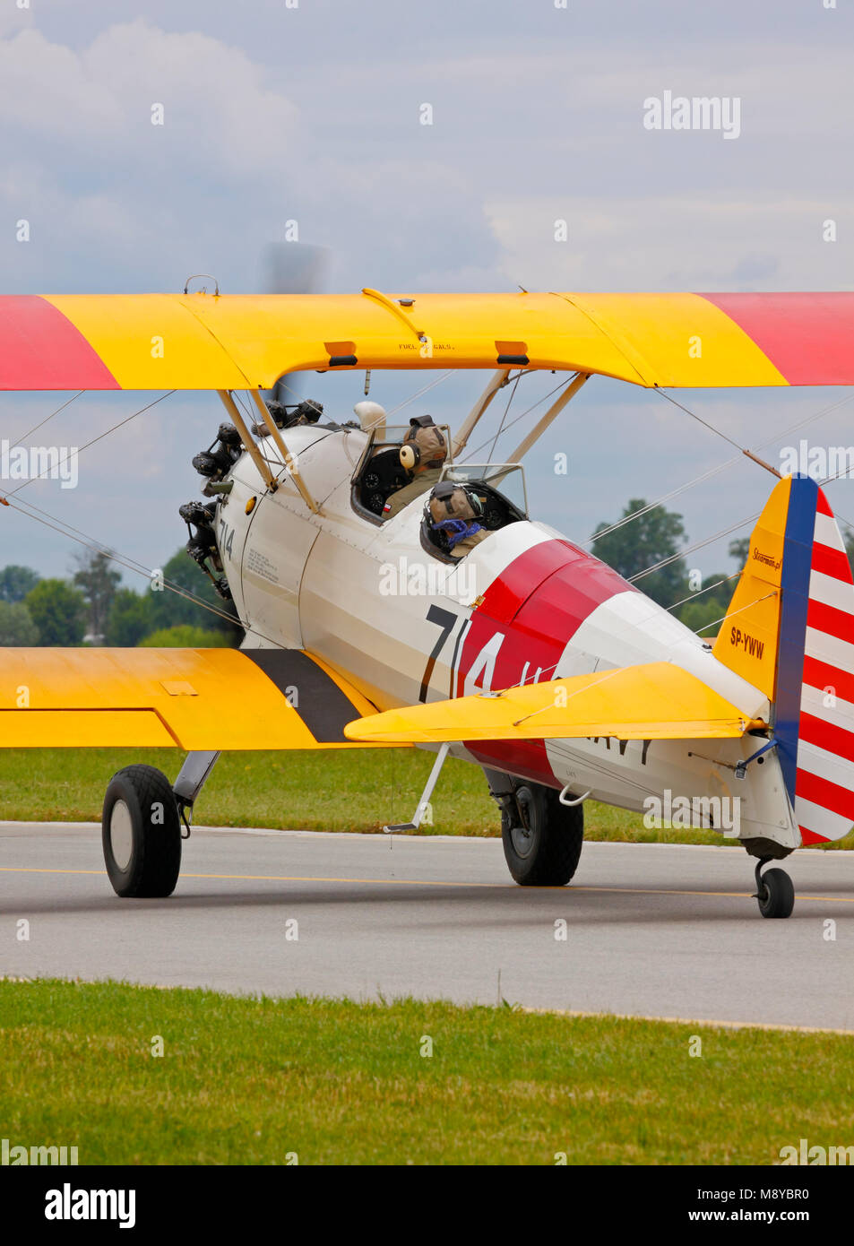 Rear view of Boeing Stearman N2S-3 in US Navy markings on runway during ...