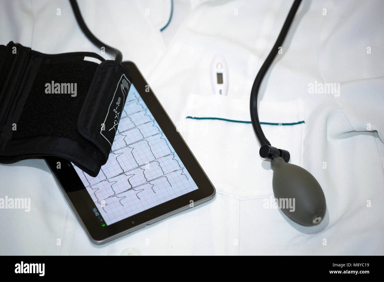 Blood Pressure Meter, Digital Tablet, Electrocardiogram And Stethoscope ...