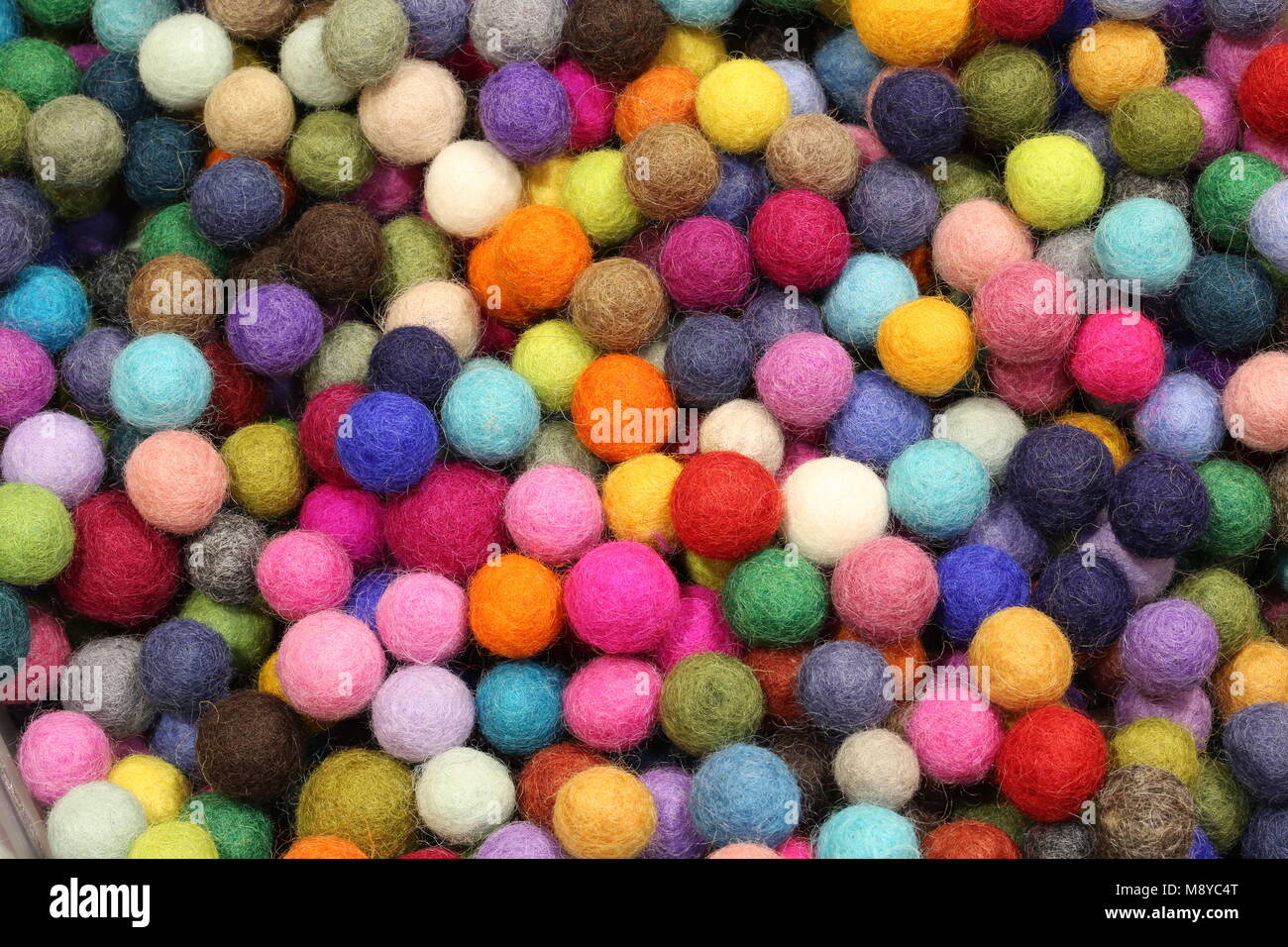 background of many colored balls made with wool Stock Photo - Alamy