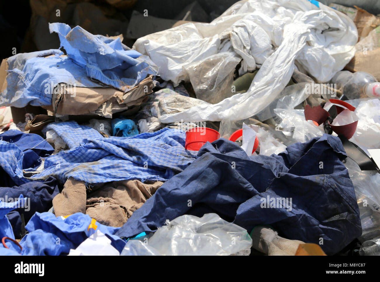rags and waste fabrics in the landfill for collecting recyclable ...