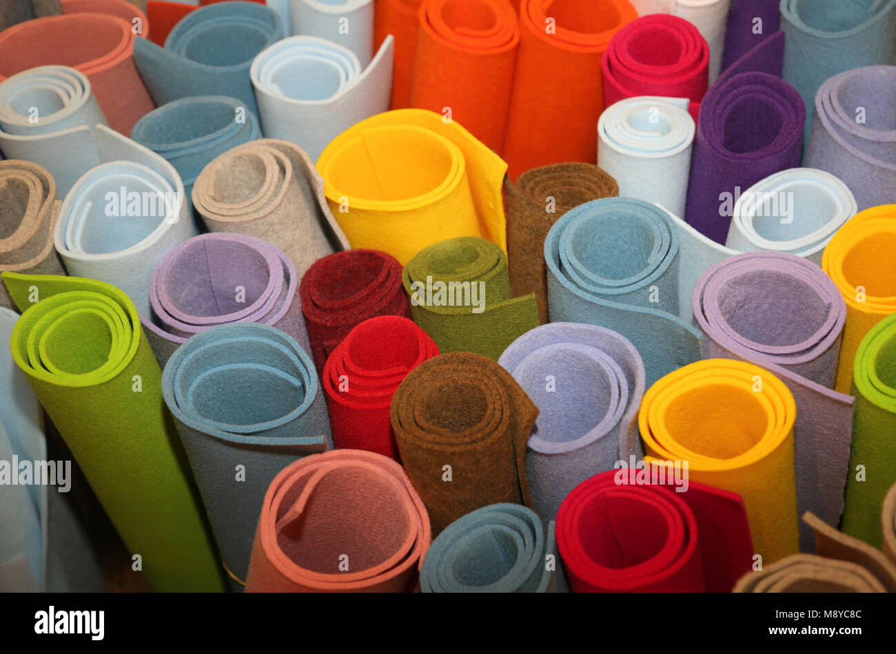 many colored rolls of fabric in the store Stock Photo - Alamy