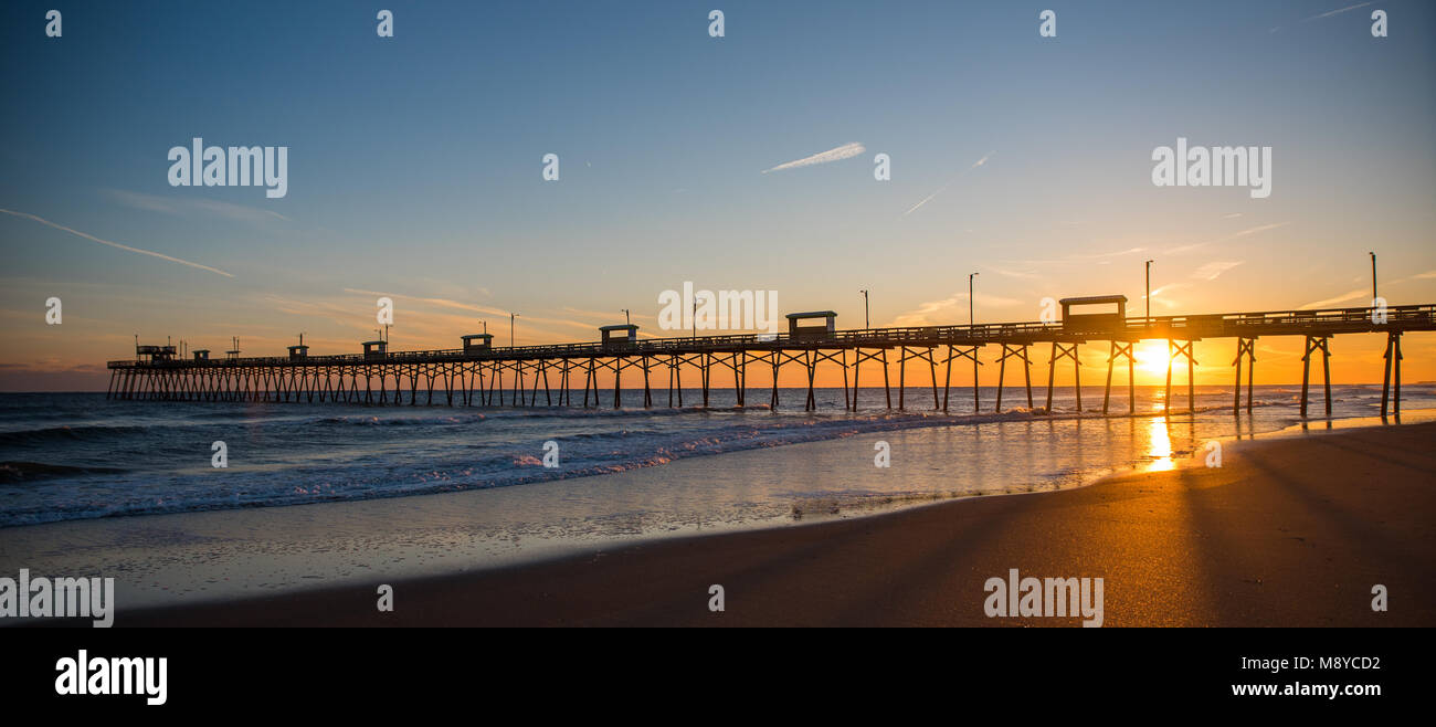 Sunset at the north carolina beach with atlantic beach pier and sunrise ...