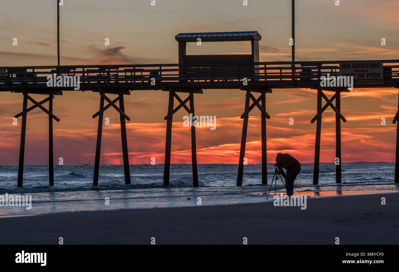 Sunset at the north carolina beach with atlantic beach pier and sunrise ...