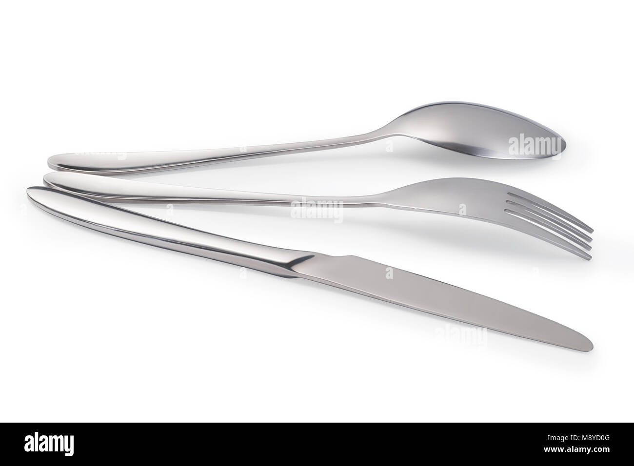 Cutlery laying on white table. Fork, knife and spoon isolated on white ...