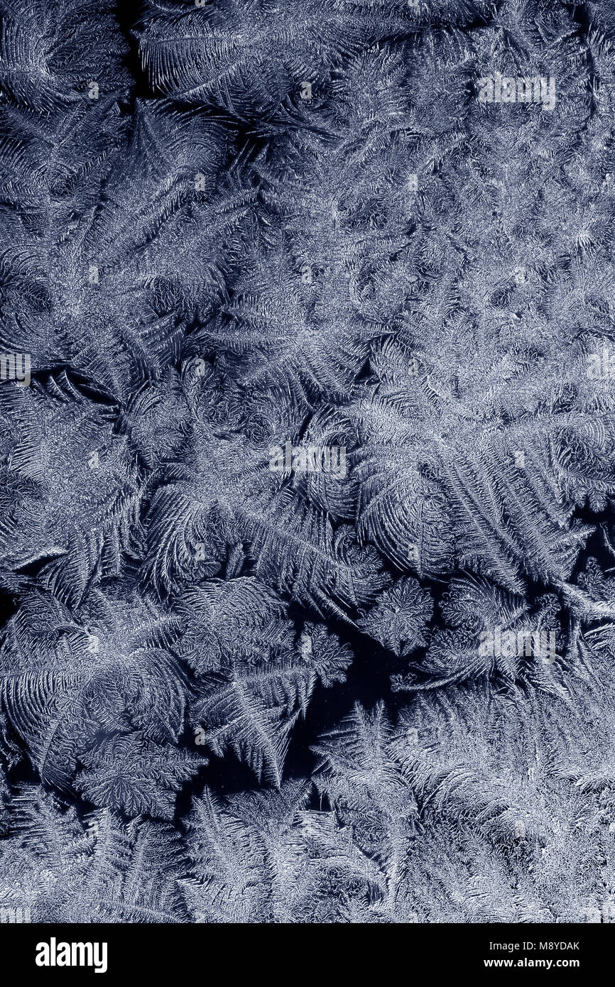 Frost patterns on window glass Stock Photo - Alamy