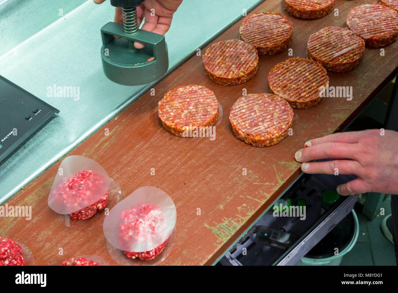 Burger making process hi-res stock photography and images - Alamy