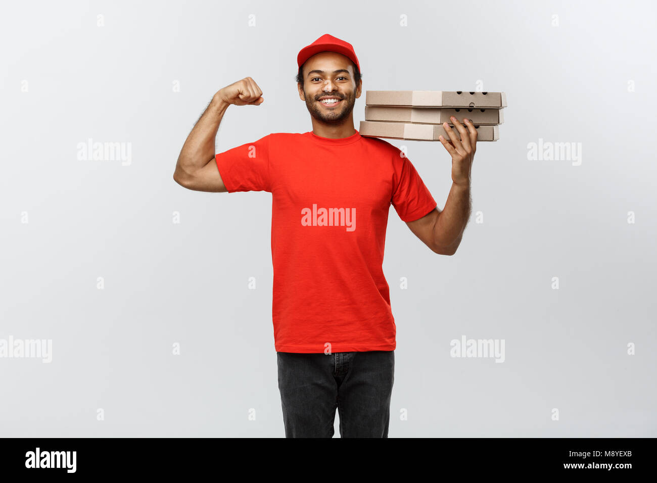 Delivery Concept - Portrait of Strong African American delivery man ...