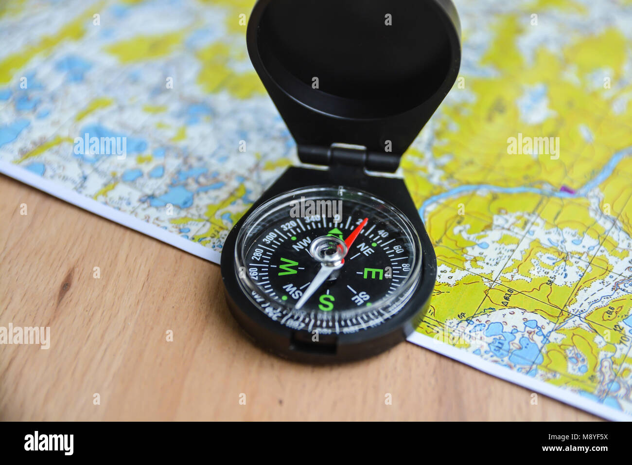 Maps and compass. Planning a trip, laying a route Stock Photo - Alamy
