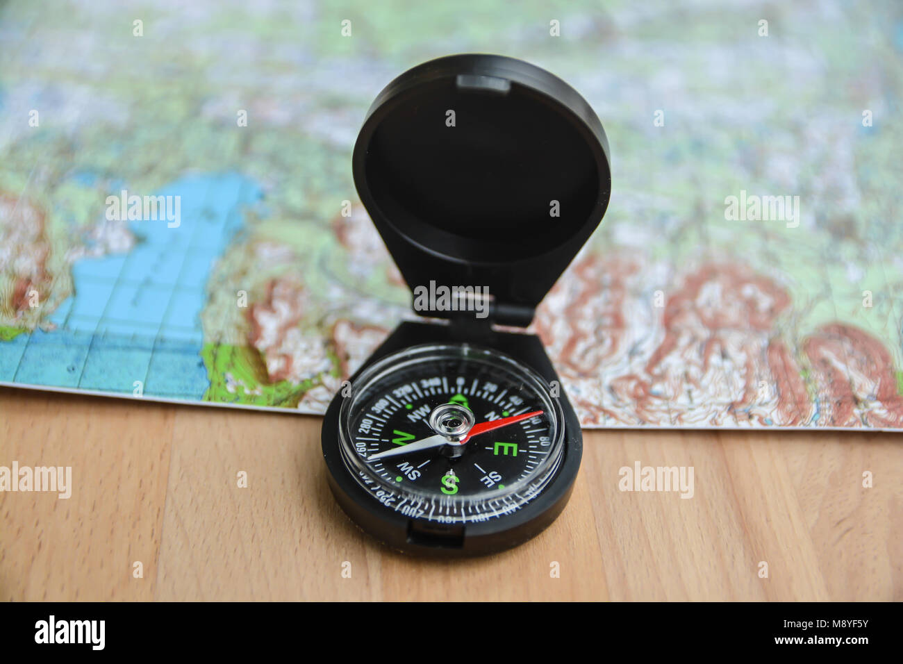 Maps and compass. Planning a trip, laying a route Stock Photo - Alamy