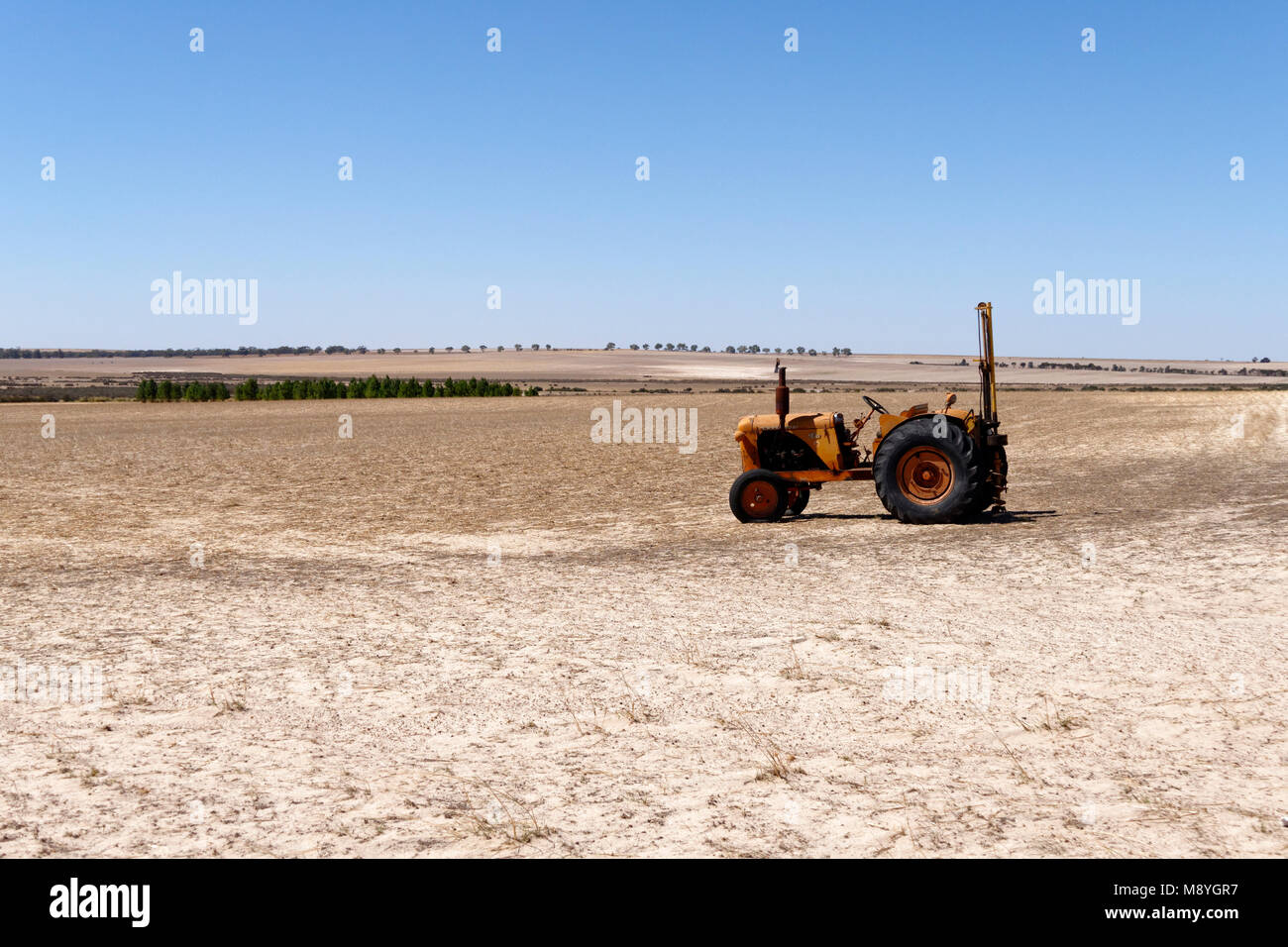 Old Champion tractor with post hole digger attached on Australian ...