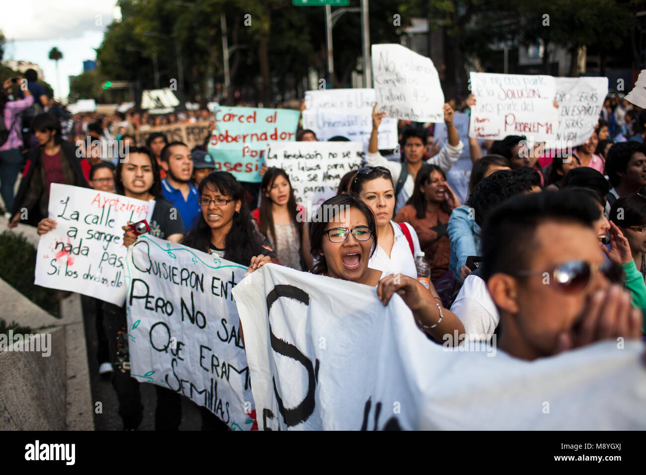 People march through Mexico City protesting for the return of 43 ...