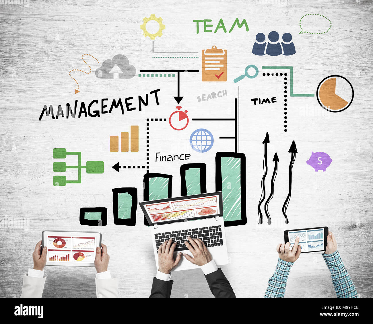 Group of three people with devices in hands working together as symbol ...