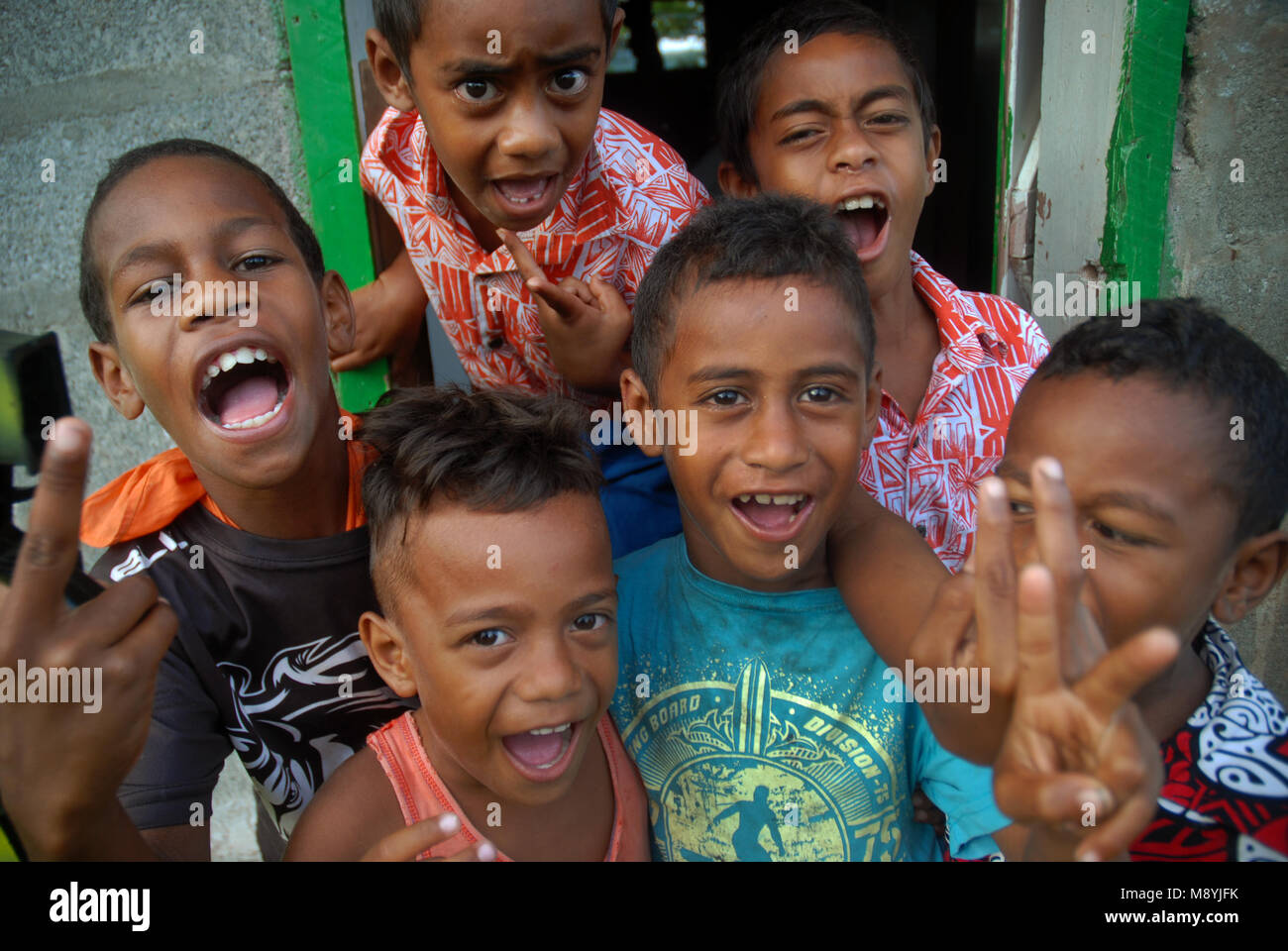 Children playing outside a house in Rakiraki, Fiji Stock Photo - Alamy