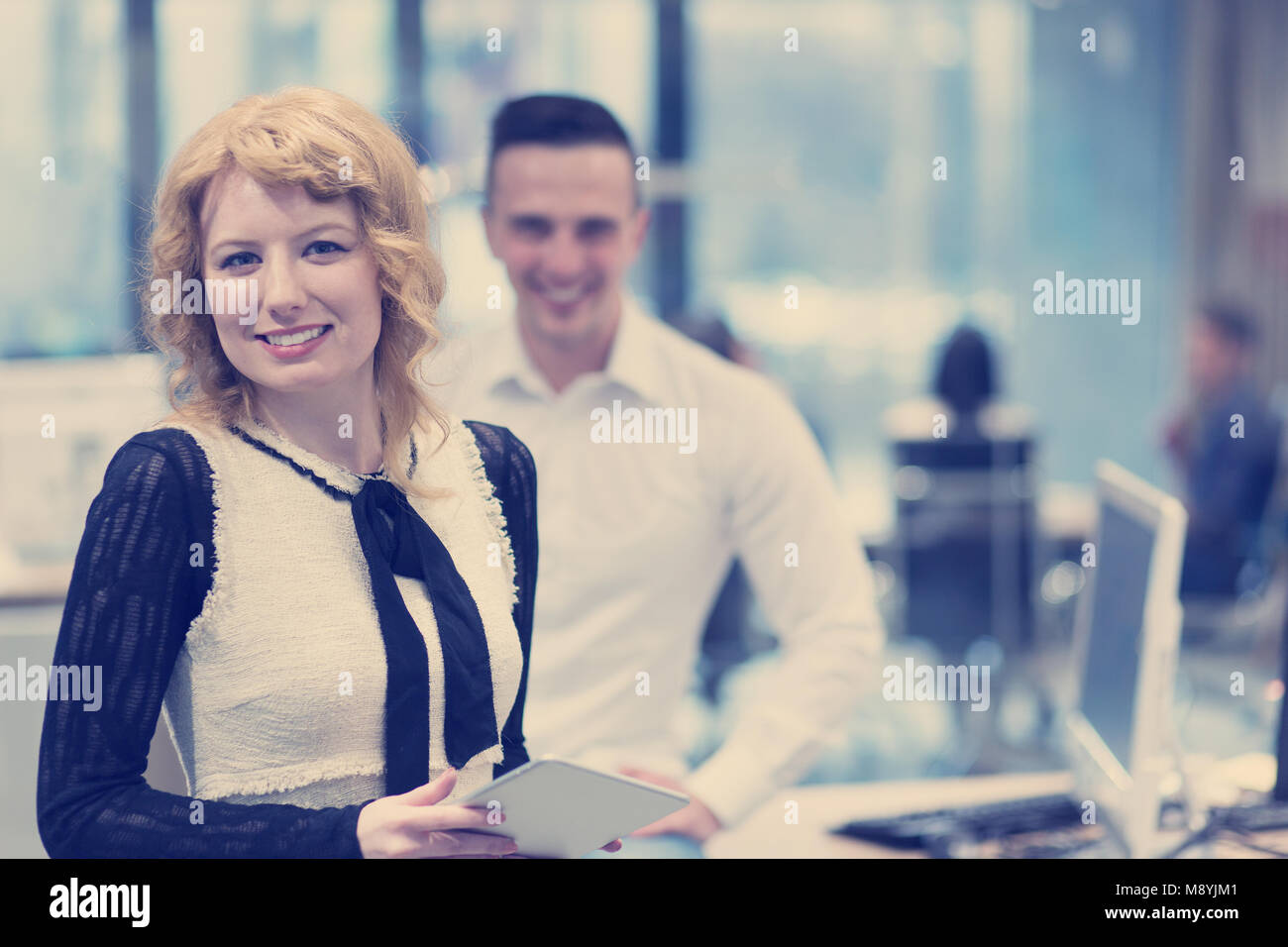 business people using tablet computer while preparing for next meeting ...