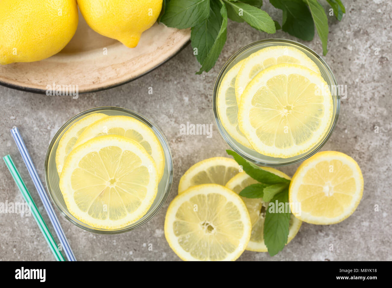 Fresh homemade lemonade or lemon water photographed overhead (Selective ...