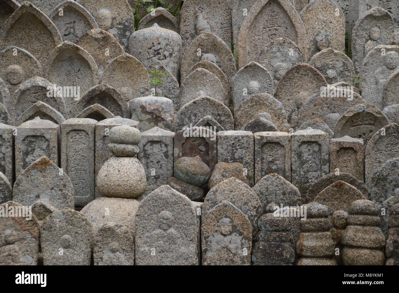 Japanese Stones Background With Stone Buddha Statues Stock Photo - Alamy