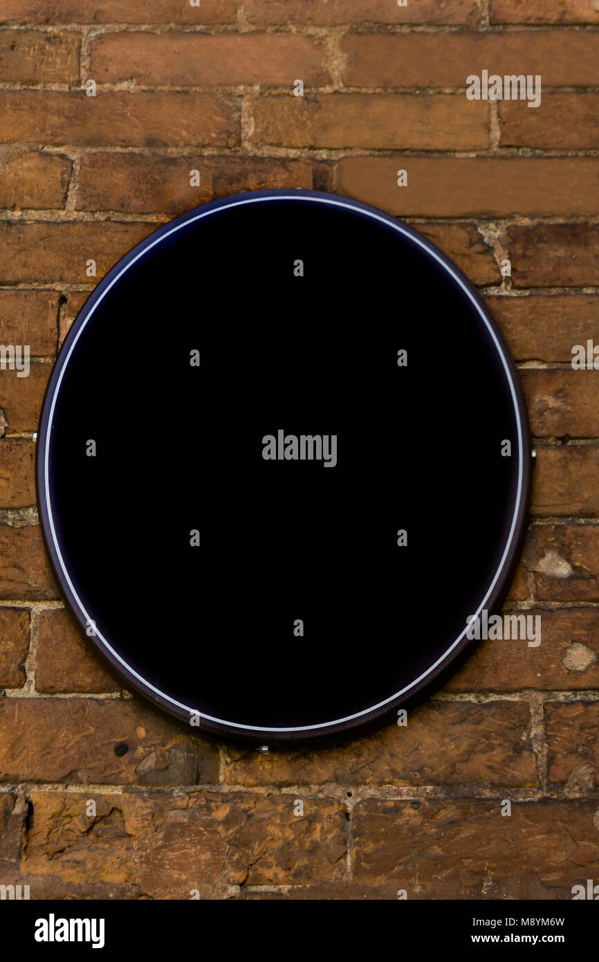 Empty oval sign with copy space on the old brick wall Stock Photo - Alamy