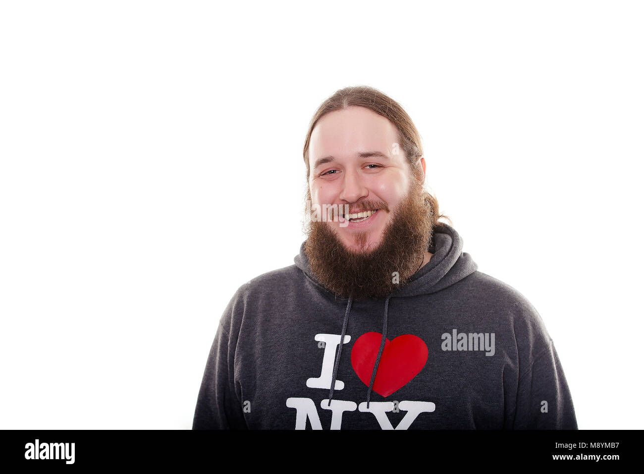Happy bearded man wearing a jumper with hood isolated on white ...