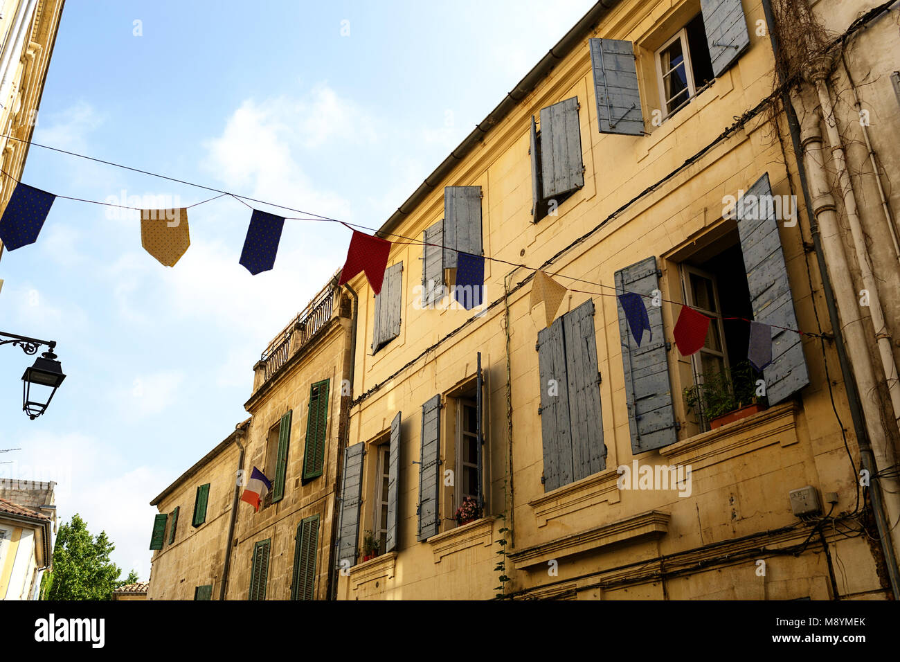 Old rustic traditional houses, Street scene in Arles, Provence, France ...