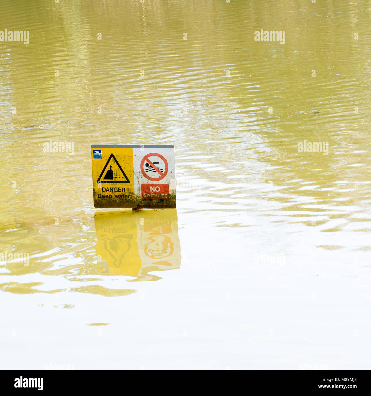 Danger deep water and no swimming warning signs in a lake in Creekmoor ...