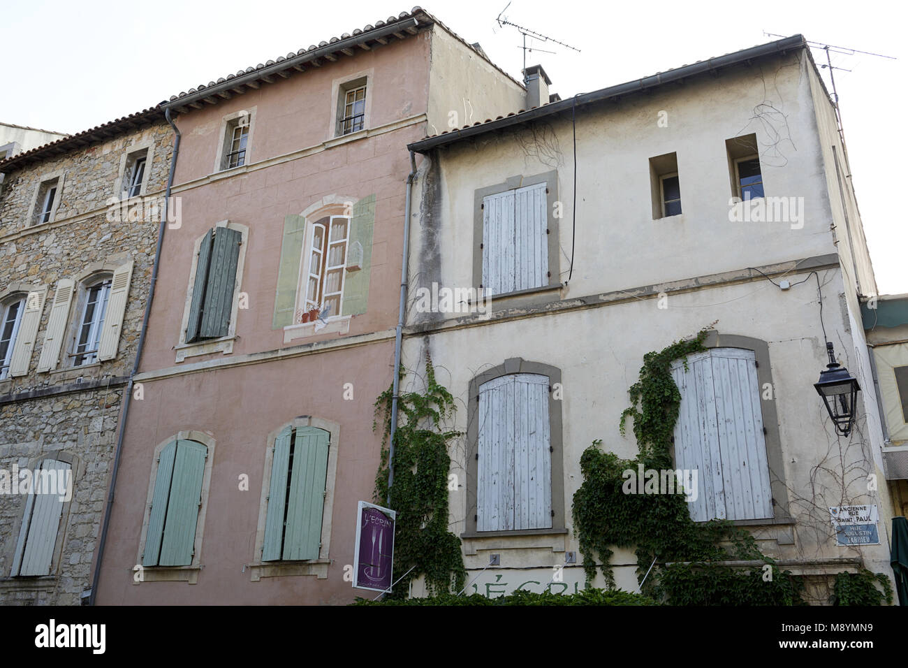 Old rustic traditional houses, Street scene in Arles, Provence, France ...