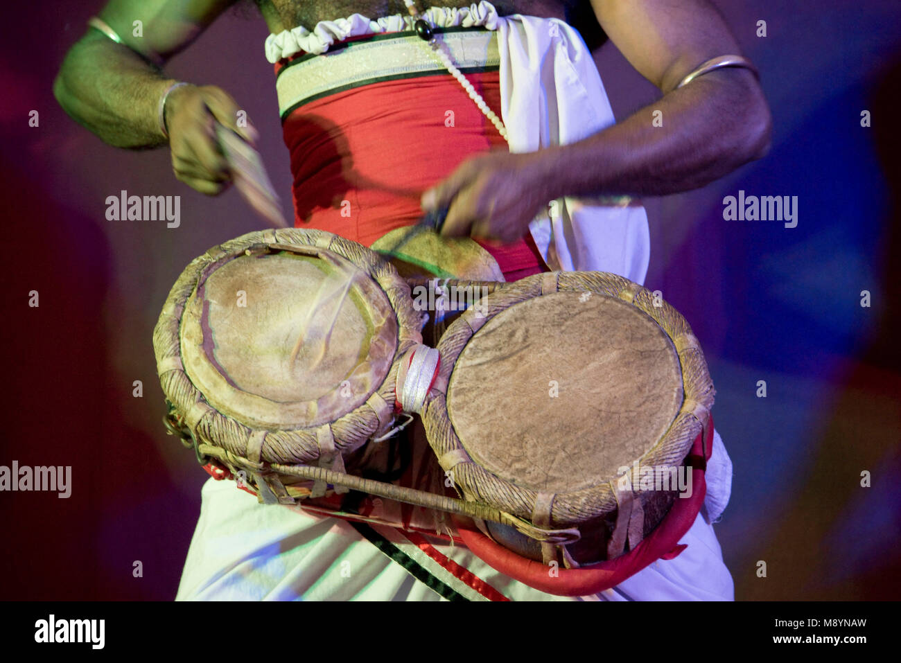 Traditional Sri Lankan dancers and musicians at a display - the drummer ...