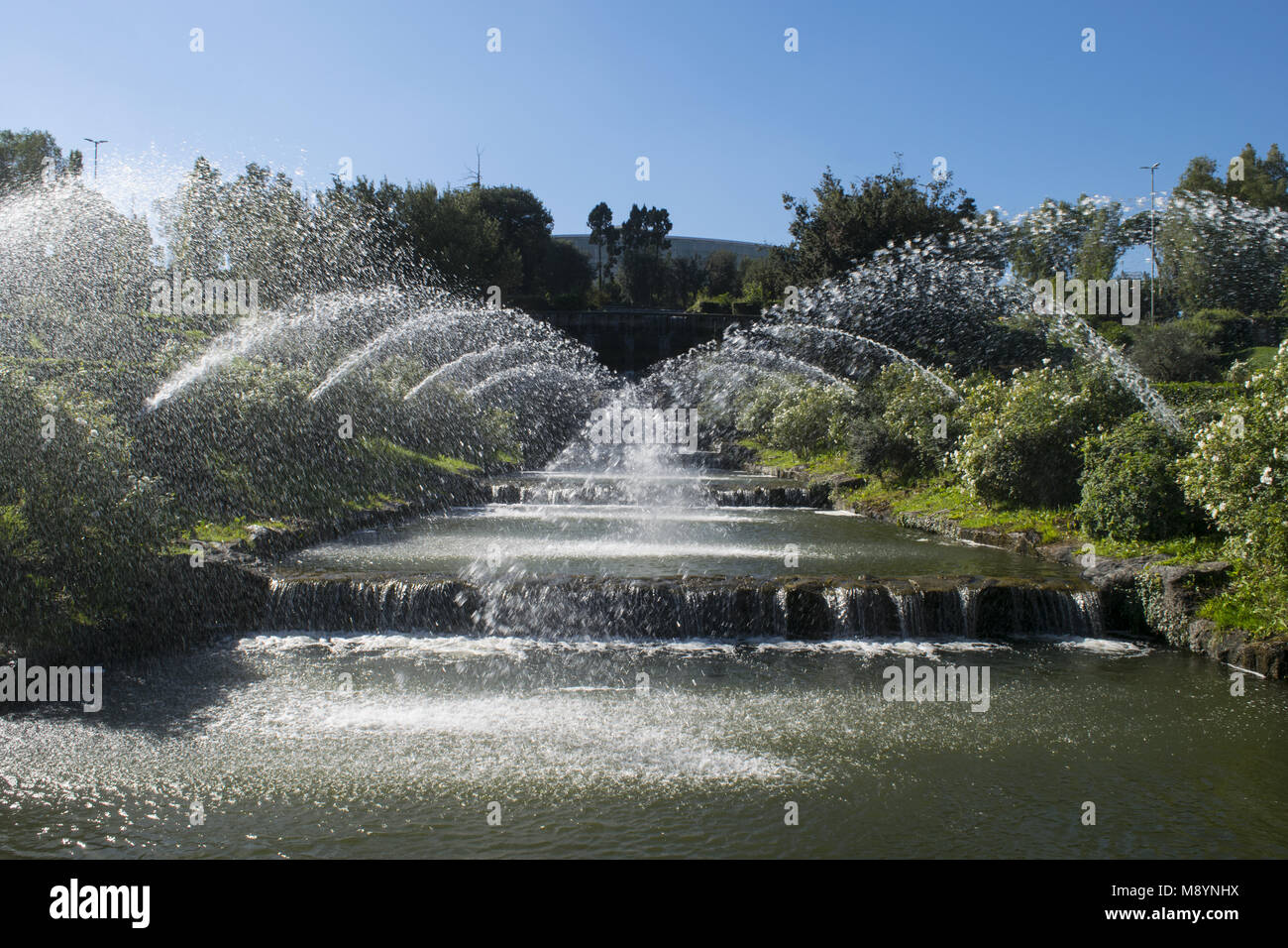 jet and splashes of water on an artificial rivulet Stock Photo - Alamy
