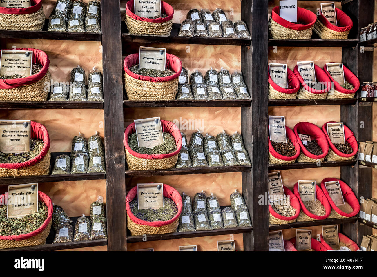 Spices, seeds and tea sold in a traditional market in Granada, Spain ...
