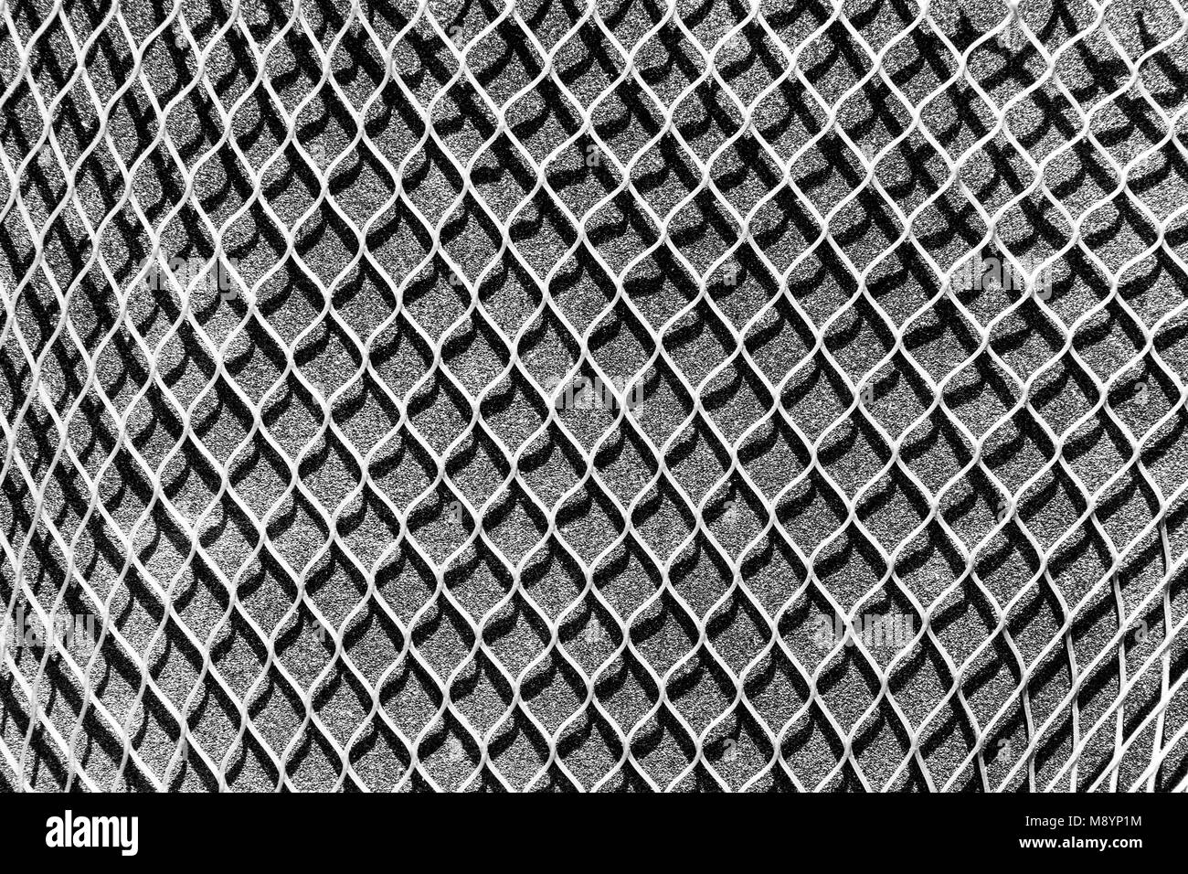 White net placed vertically on sponged grey background surface Stock ...