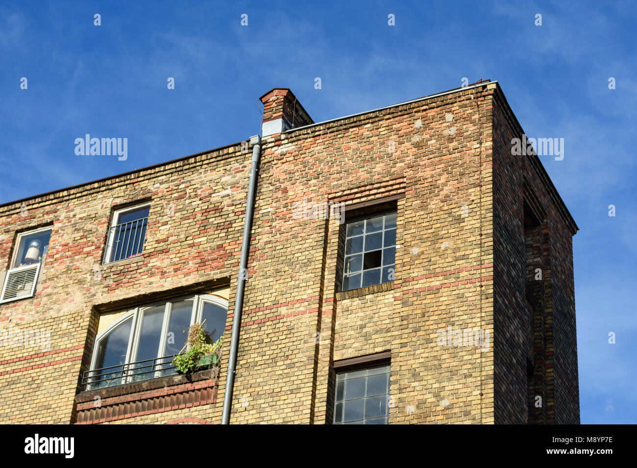 romantic brick house against blue sky Stock Photo - Alamy